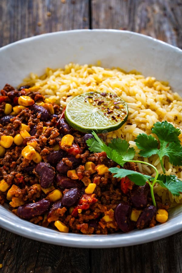 Chili Con Carne with Rice on Wooden Table Stock Image - Image of dinner ...