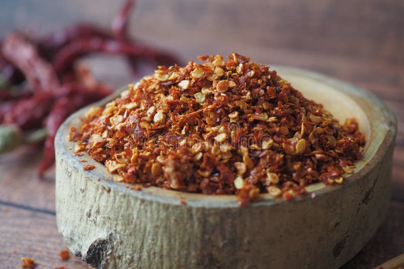 Chili Flakes in a Bowl on Table Stock Photo - Image of bright, aromatic ...