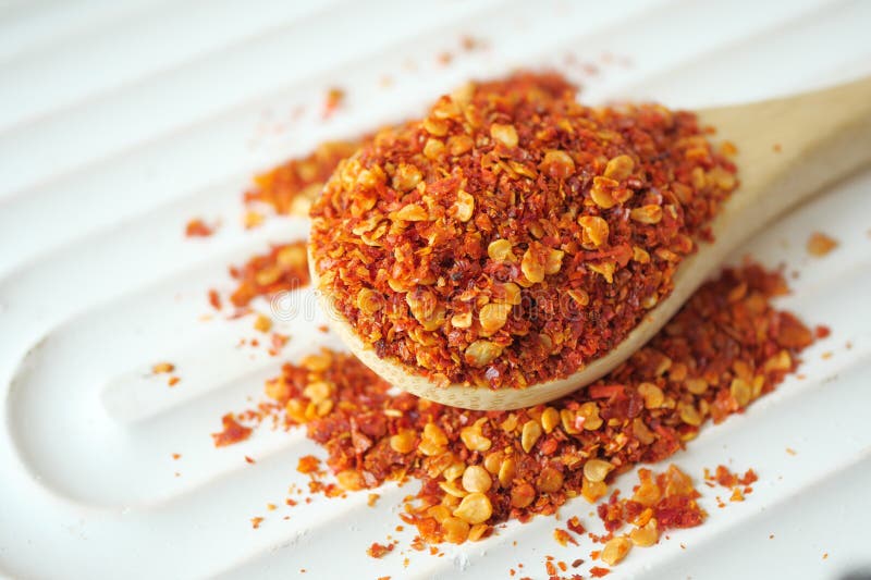 Chili Flakes on a Wooden Spoon on Table Stock Image - Image of flavor ...