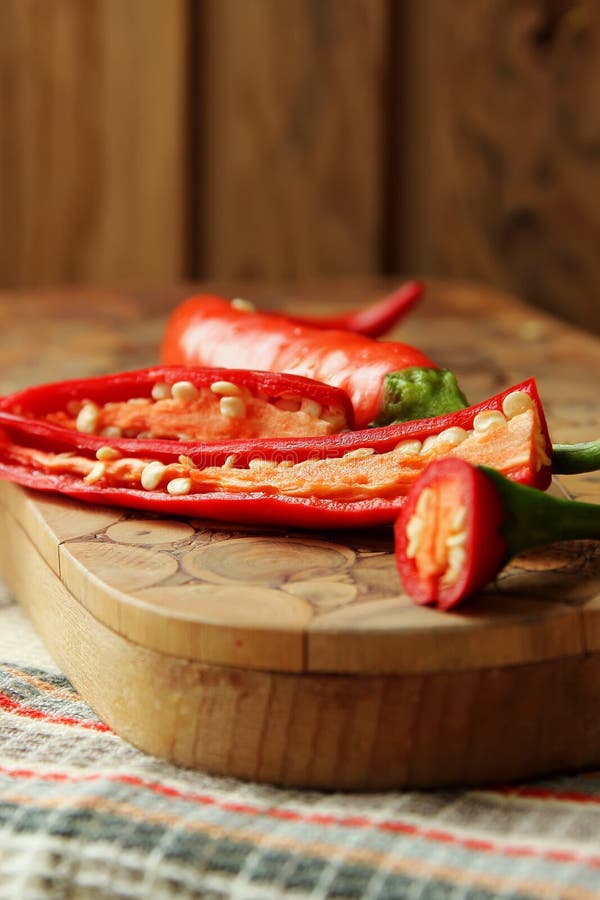 Chili pepper, cut in half stock image. Image of food - 43575115