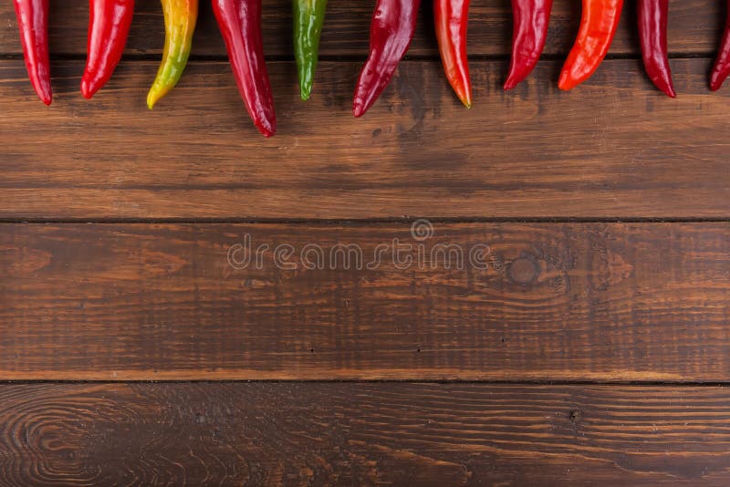 Chili Pepper on Wooden Table Stock Image - Image of detail, black ...