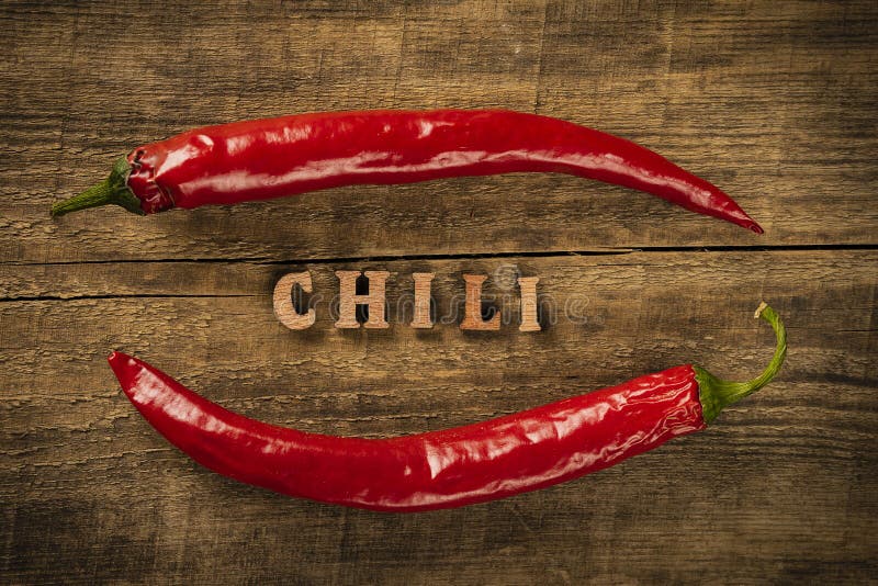 Chili Pepper on a Wooden Table. Rustic Style in a Low Key. Lettering in ...