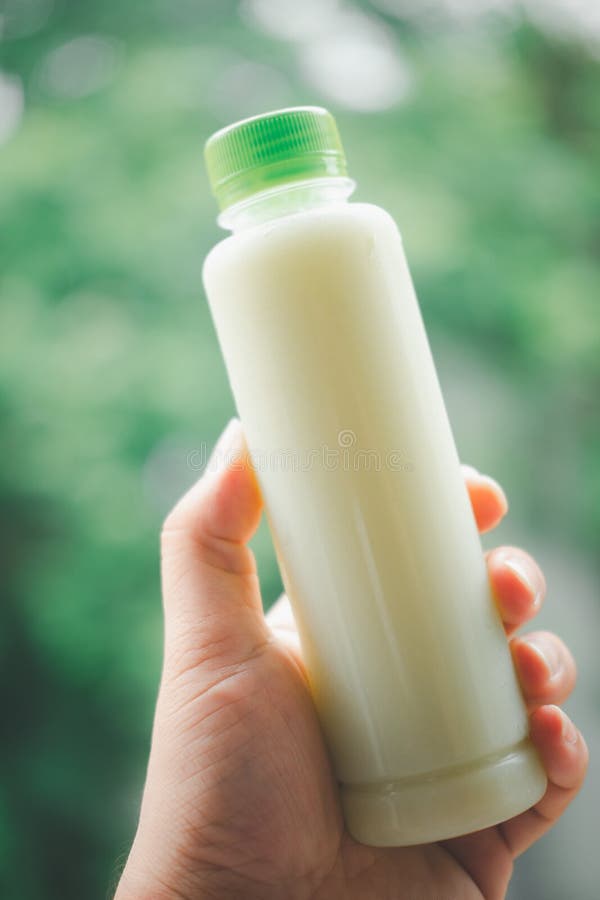 Chilled Guava Juice Bottles on Man Hand Stock Image - Image of ...