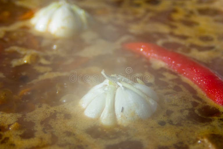Chilli and Garlic Cooked in a Cauldron. Stock Image - Image of tomato ...