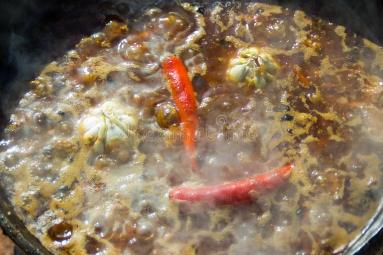 Chilli and Garlic Cooked in a Cauldron. Stock Photo - Image of chili ...