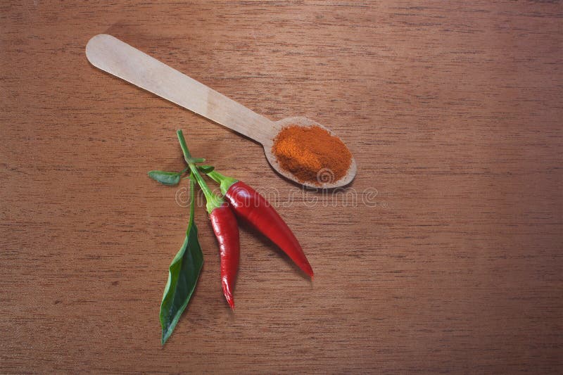 Chilli Pepper and Chilli Powder Stock Image - Image of spoon, wooden ...