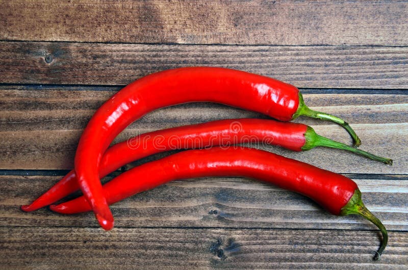 Chilli pepper on table stock photo. Image of cayenne - 55808842