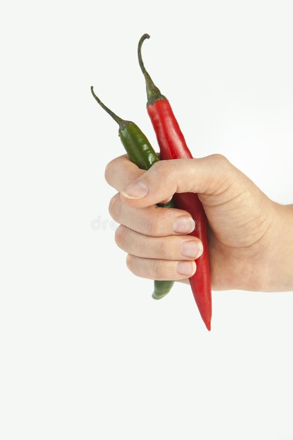 Chilli peppers in hand stock image. Image of orange, mexican - 27014813
