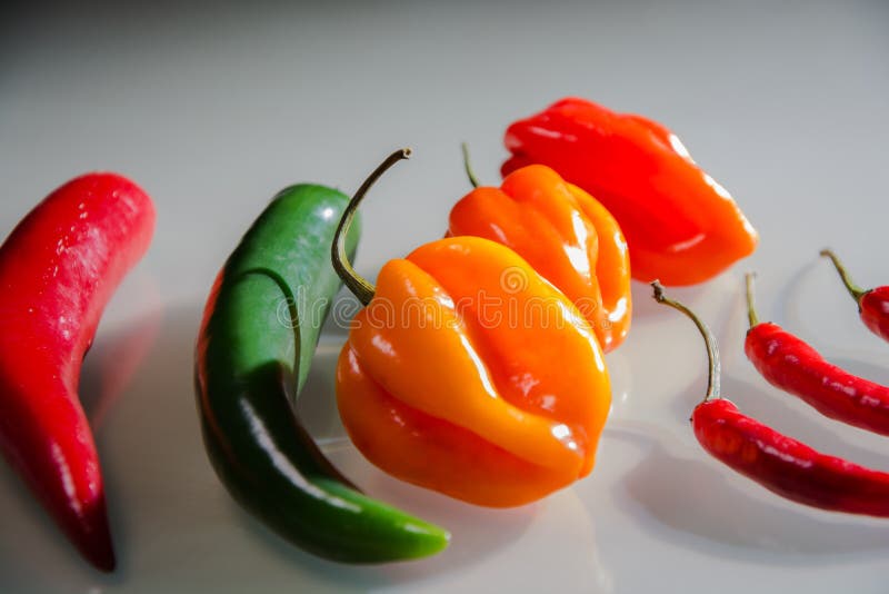 Chillies, Different Types and Colors in the Foreground Stock Photo ...