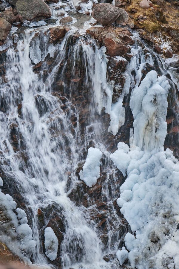 Chilly Cascade Waterfall, Where Water Rushes Over Icy Rocks ...