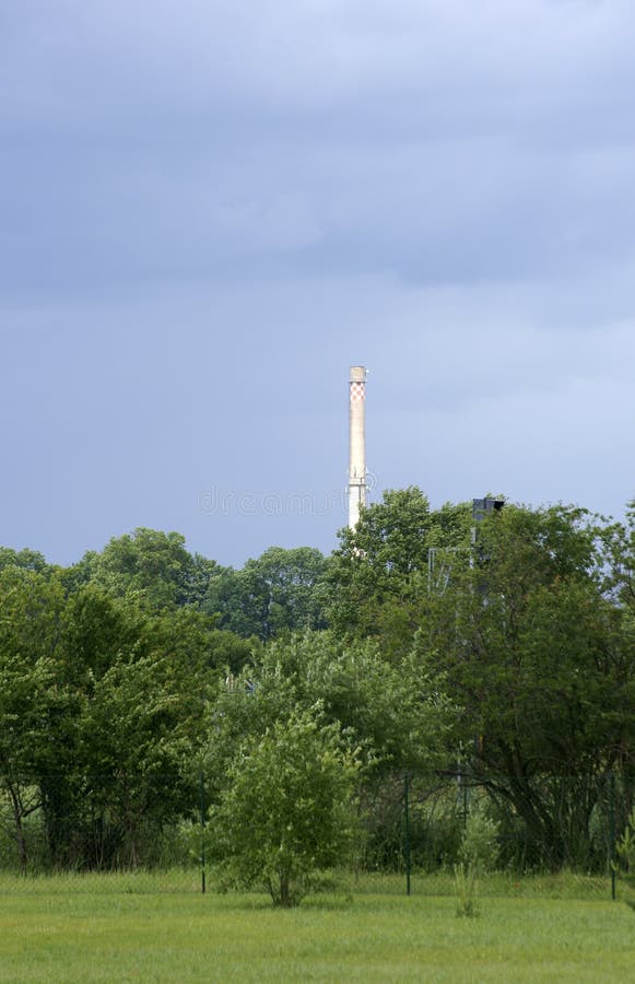 Chimney behind trees stock image. Image of bushes, grass - 44948901