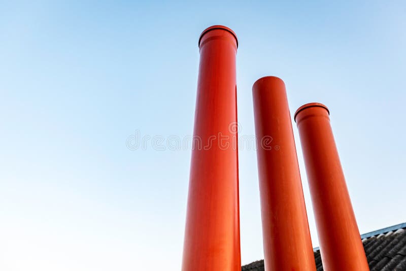 Chimney from Orange Pipes on Roof of House. Stock Image - Image of ...