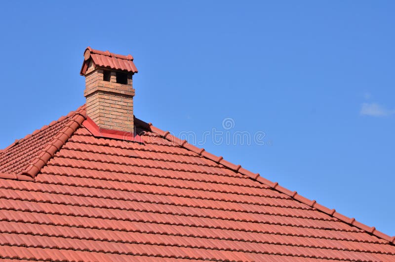 Chimney on tile roof stock photo. Image of construction - 71670186