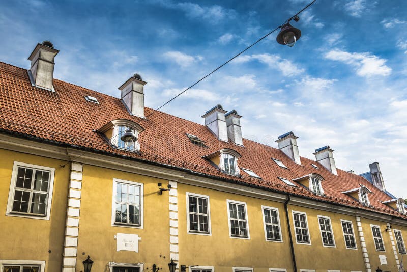 Chimneys and Red-tiled Roofs of the Old Yellow Building in Old R Stock ...