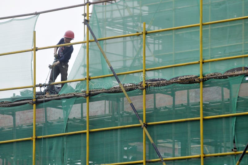 Bricklayers on scaffolding stock image. Image of council - 103895