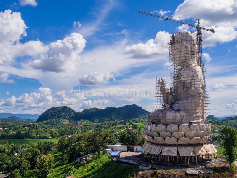 Chinese Angle Statue in Mountain View Under Cloudy Blue Sky Stock Photo ...