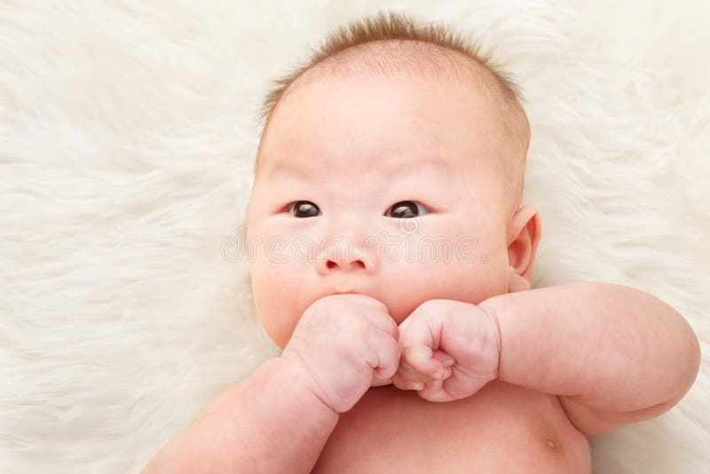 Chinese baby face smirking stock photo. Image of looking - 19376676