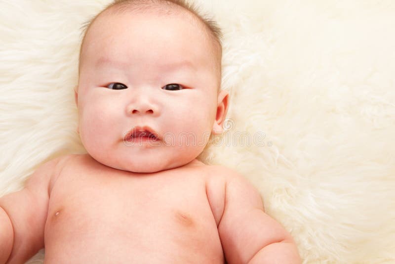Chinese baby face smirking stock photo. Image of looking - 19376676