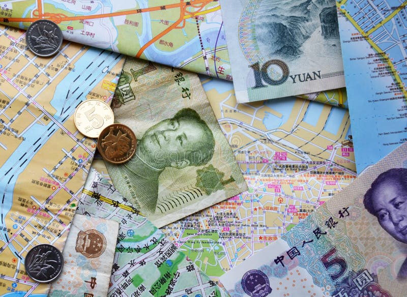 Chinese Bank Notes and Coins on a Chinese Maps Stock Photo - Image of ...