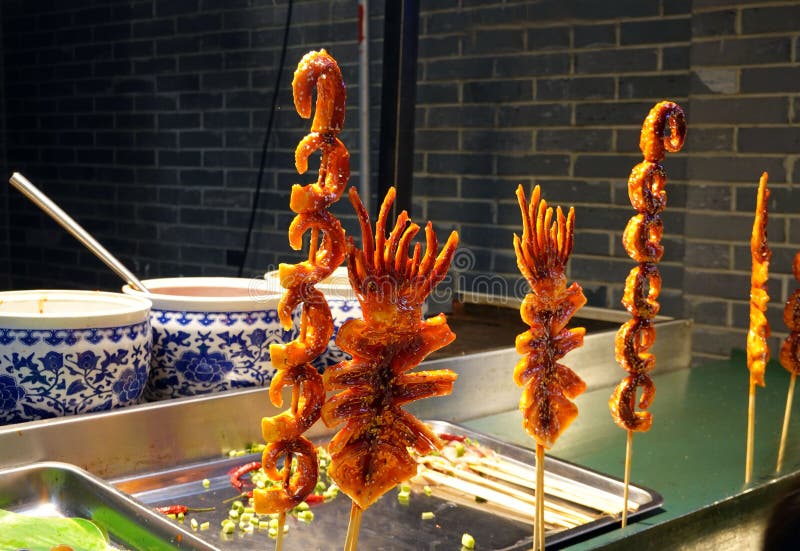 Chinese Barbecue Squid on Stick at the Market Stock Photo - Image of ...