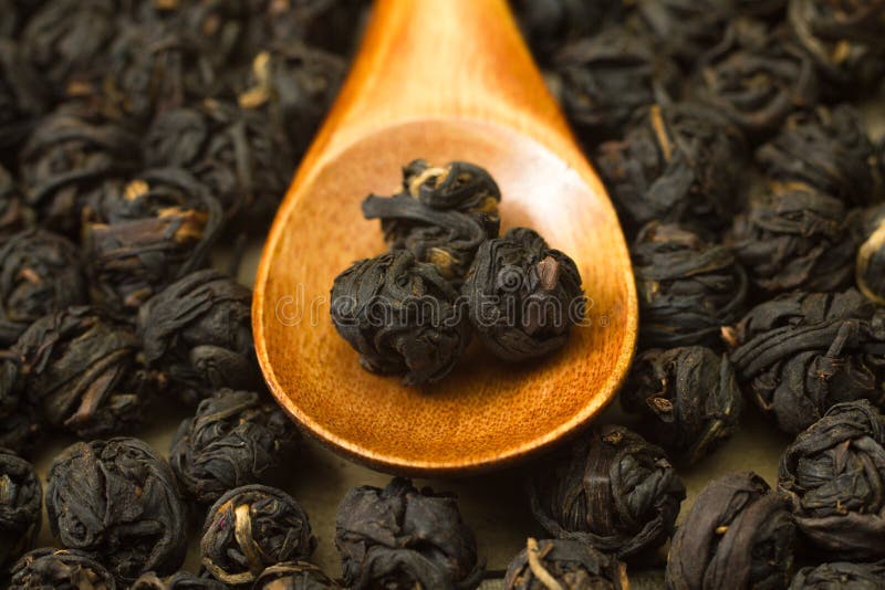 Chinese Black Tea Leaf Balls Inside Wooden Spoon Stock Image - Image of ...
