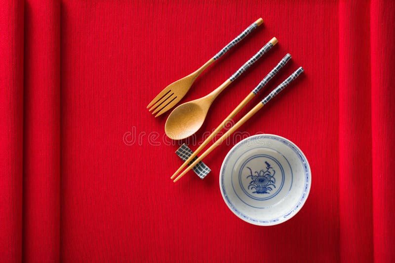 Chinese Bowl, Fork, Spoon and Chopsticks on Red Mat Stock Image - Image ...