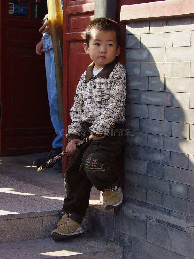 A Chinese boy playing editorial stock image. Image of china - 17498944
