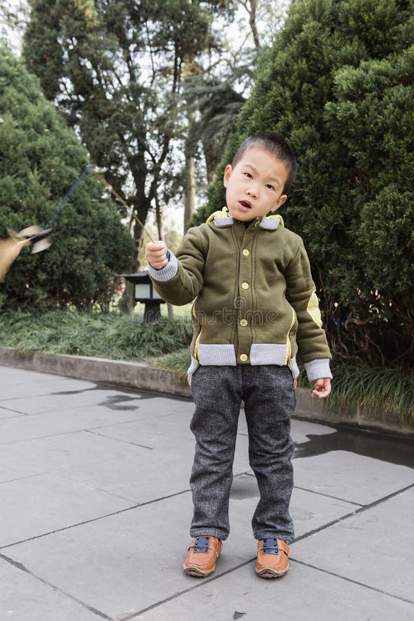 Chinese boy playing toy stock image. Image of hold, playing - 51535561