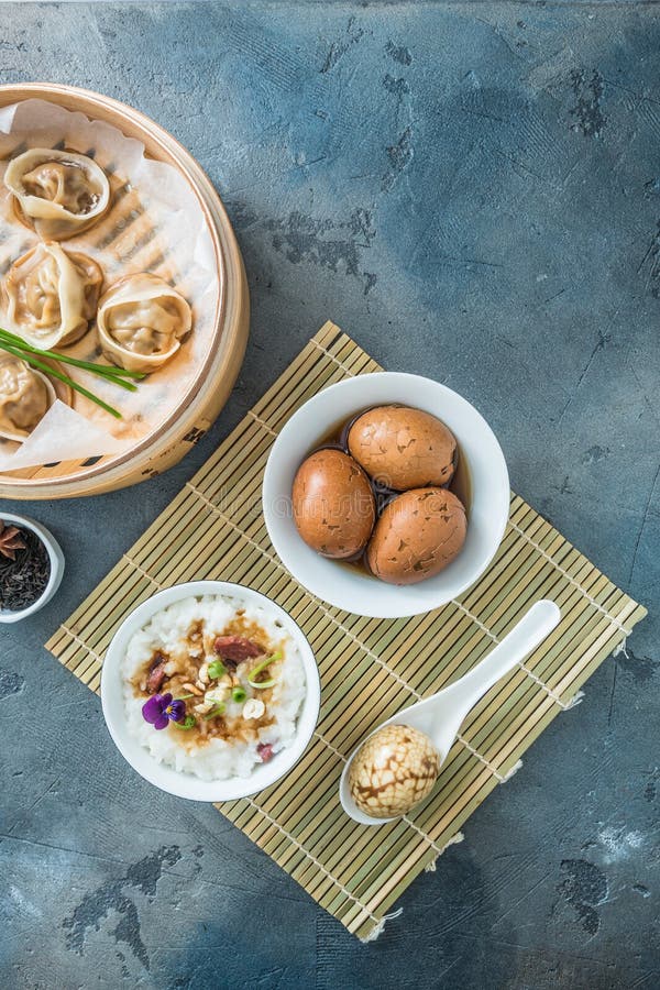 Chinese Breakfast with Rice Porrige, Tea Eggs and Dim Sum Stock Photo ...