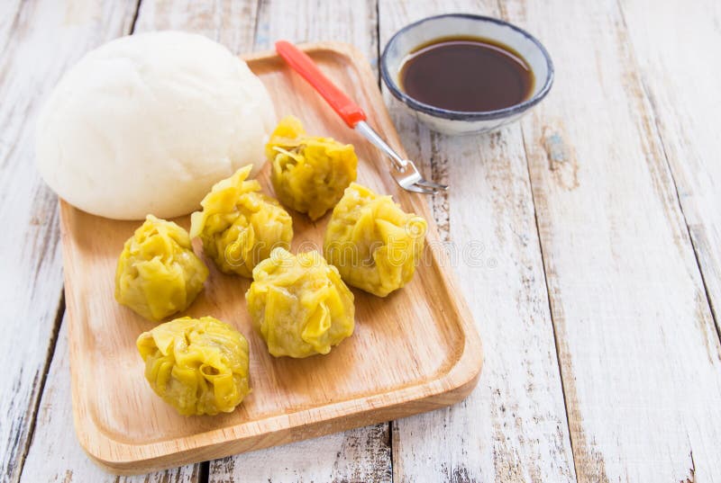 Chinese Buns and Dumpling in Wooden Plate Stock Photo - Image of ...