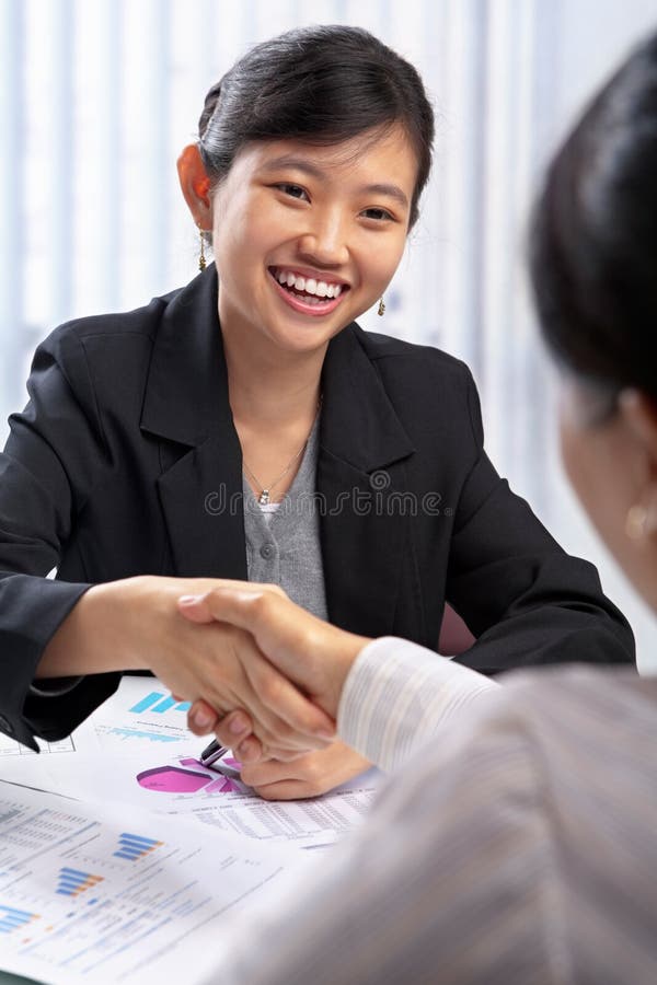 Chinese Busineswoman Handshake with Her Client Stock Photo - Image of ...