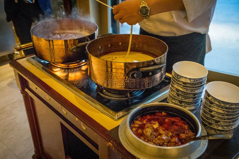 A Chinese Chef Cooking Chinese Noodles at a Live Cooking Station Stock ...