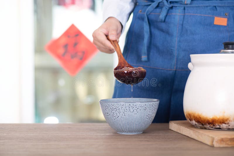 Chinese Chef Put Laba Porridge in Casserole into a Bowl Stock Image ...