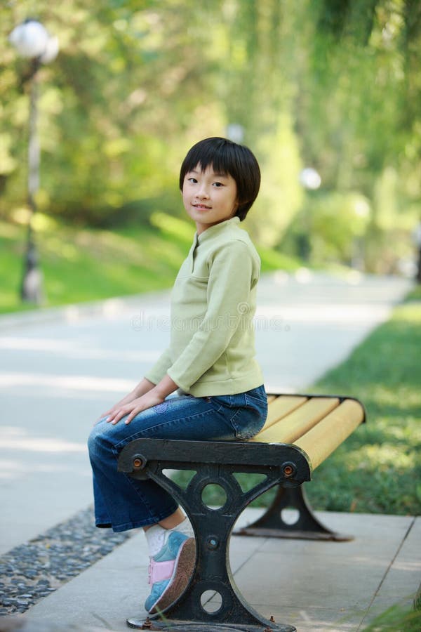 Chinese Child Prepares To Start Running Stock Photo - Image of hair ...