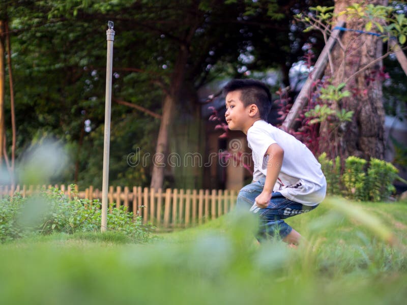 Chinese Child Boy Crouch Park Stock Photos - Free & Royalty-Free Stock ...