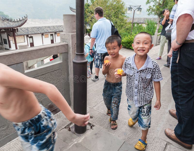 Chinese children eat fruit editorial stock photo. Image of tourist ...