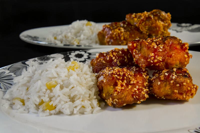 Chinese Crispy Sesame Chicken with Rice and Corn Stock Photo - Image of ...