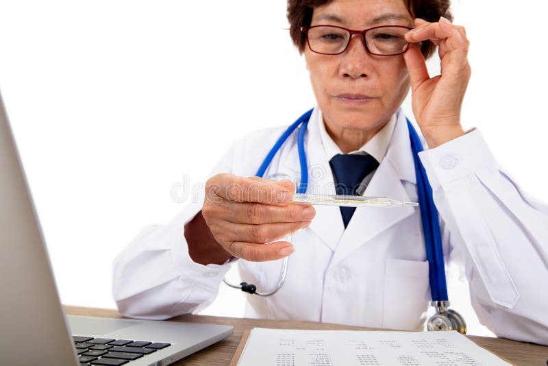 The Chinese Doctor at Work is Looking at the Thermometer Stock Image ...