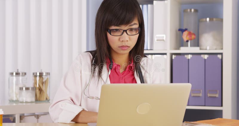 Chinese Doctor Working on Laptop Stock Video - Video of smiling, care ...