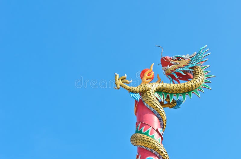 Chinese Dragon Wrap on Pole with Red Ball in Blue Stock Image - Image ...