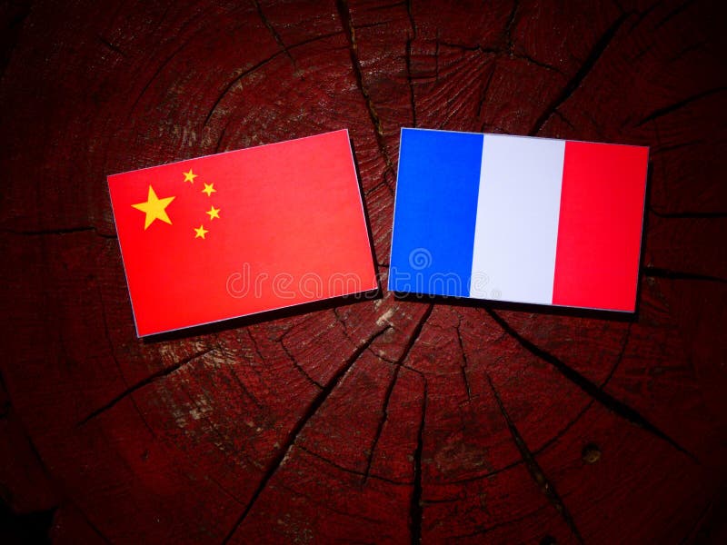 Chinese Flag with French Flag on a Tree Stump Isolated Stock Image ...