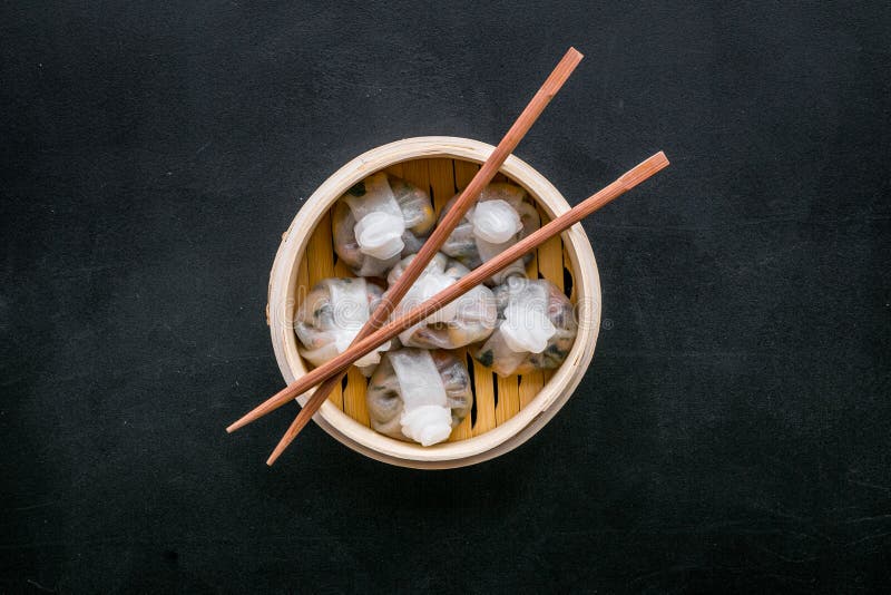 Chinese Food Set With Dim Sum, Sticks On Black Background Top View ... Chinese Food Set With Dim Sum, Sticks On Black Background Top View ...