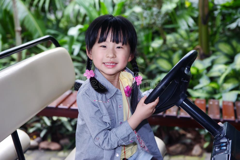 Chinese Girl in the Rainforest Stock Photo - Image of pigtail, steering ...