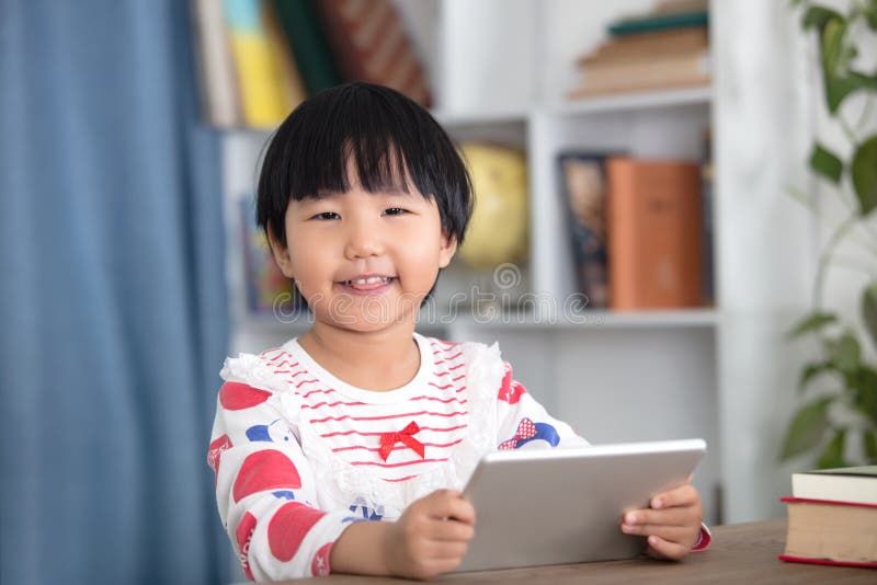 Chinese Girl is Using Tablet Stock Image - Image of online, race: 196173451