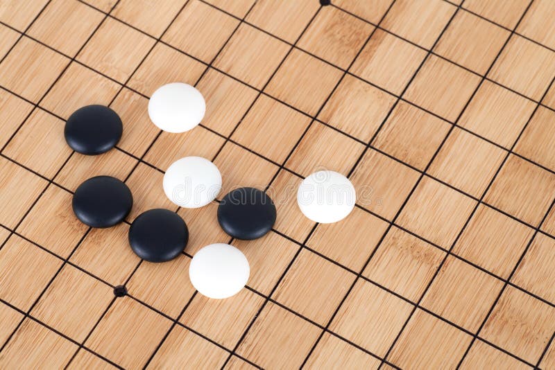 Chinese Go Game on board stock photo. Image of move - 228924618