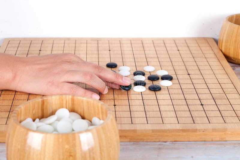 Chinese Go Game on board stock image. Image of tools - 228924553