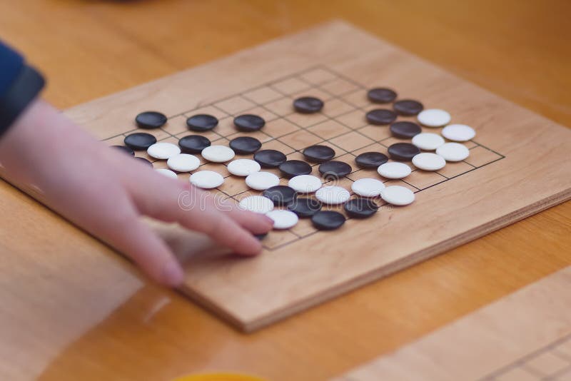 Chinese Go Game Board, Close Up View of Playing Black and White Stone ...