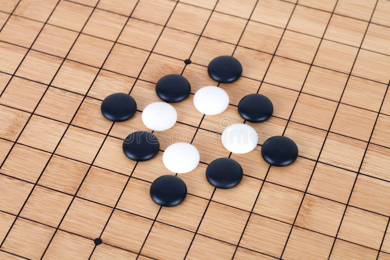 Chinese Go Game on table stock photo. Image of looking - 228924322