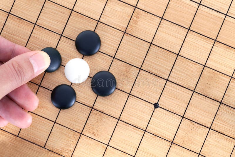 Chinese Go Game on table stock image. Image of intelligence - 228924351