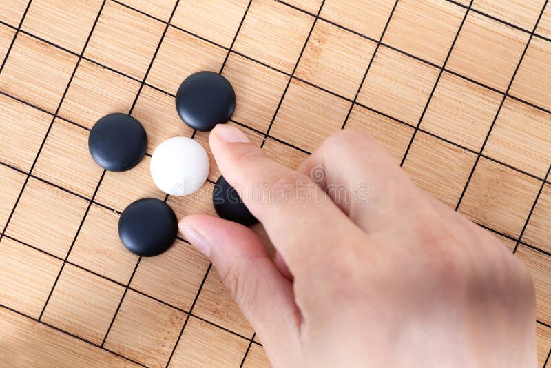 Chinese Go Game on table stock photo. Image of intelligence - 228924352